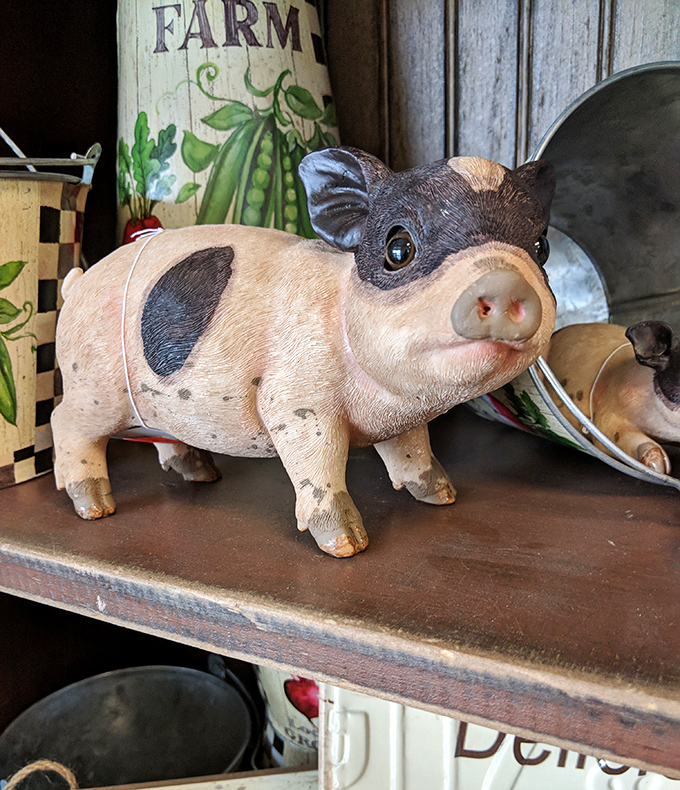 This decorative pig figurine dares you to walk away. Three hours later, you're explaining to your spouse why it "spoke to you." 