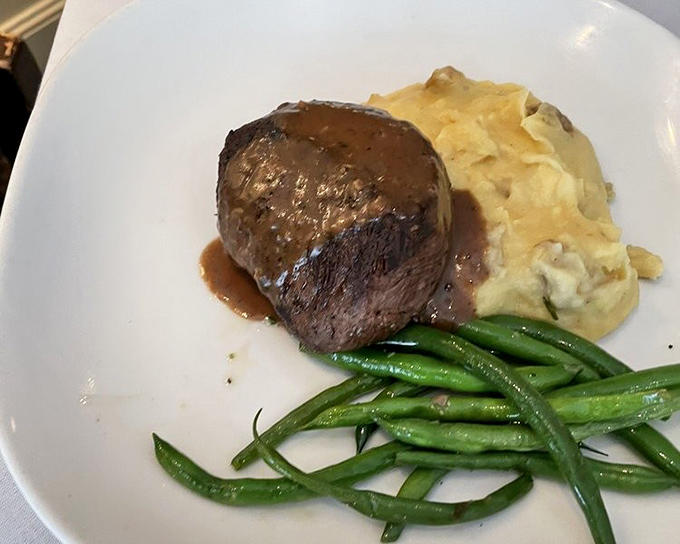 This filet mignon doesn't need a passport to transport you to heaven. The mashed potatoes are just the cloud you'll float away on.