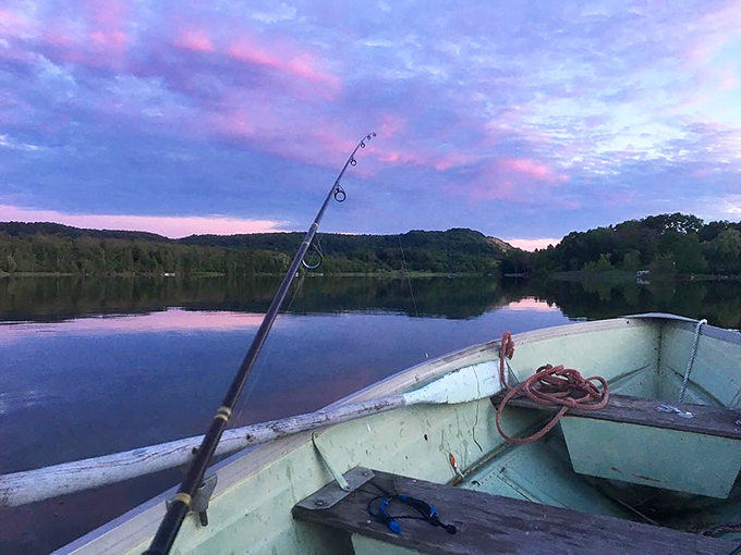 Dawn fishing from a weathered boat&mdash;Michigan's version of meditation. That pink-purple sky is nature showing off its Photoshop skills without using Photoshop.