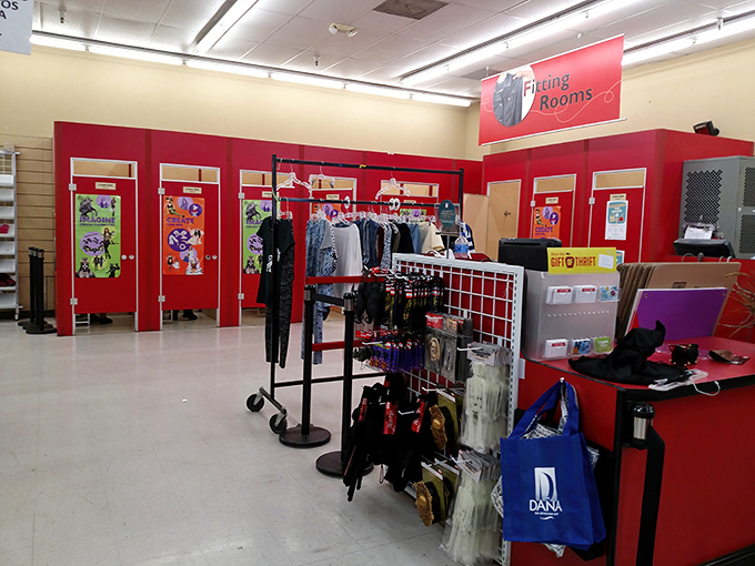 The fitting room area: where retail dreams meet reality. Those red doors have witnessed countless "maybe in another lifetime" fashion moments.