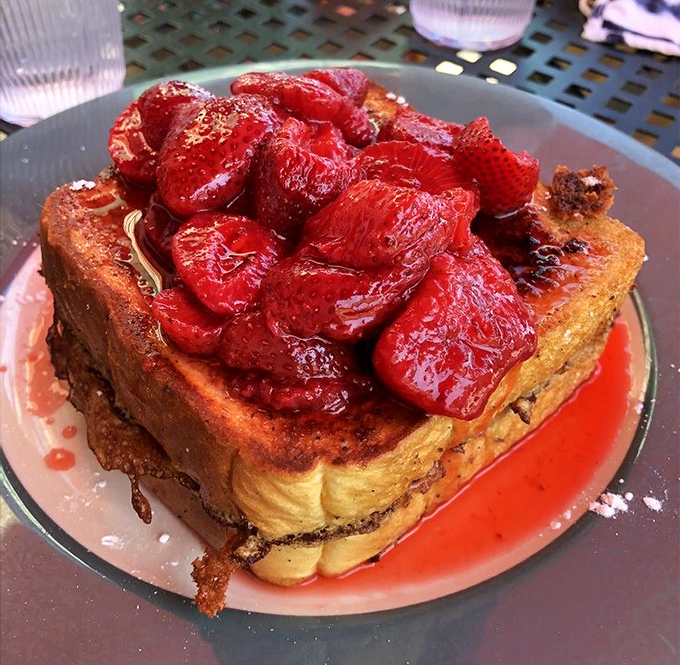 French toast that makes you question why anyone would eat regular toast ever again. Those strawberries aren't garnish &ndash; they're the crown jewels.