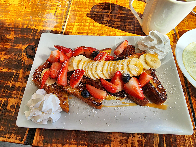 French toast that's dressed for success with fresh berries, bananas, and enough whipped cream to make your diet plan weep.