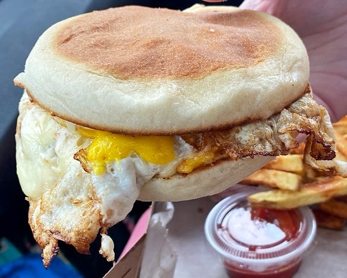 Breakfast's greatest hits on a bun. This fried egg sandwich proves that simplicity, when executed with care, creates food memories that last a lifetime.
