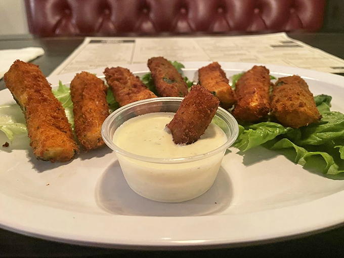 Fried zucchini that makes eating vegetables feel like cheating. The dipping sauce is just a bonus round of indulgence.