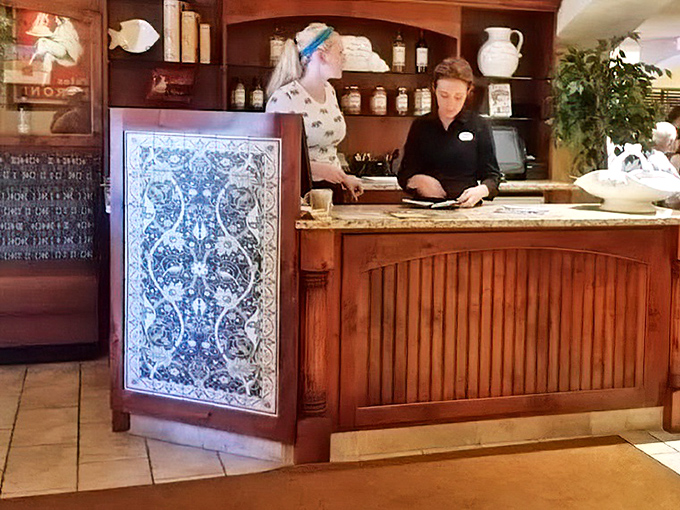 The reception desk's decorative tile work adds that touch of Mediterranean flair &ndash; first impressions matter in the restaurant world.