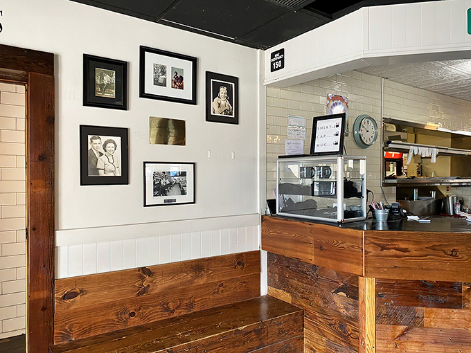 Wood paneling and family photos—because every great diner needs a wall of fame and memories.