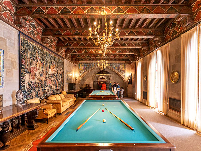 A billiards room where Chaplin might have played against Churchill, beneath a ceiling that belongs in a European cathedral. Just an average game night at Hearst Castle.