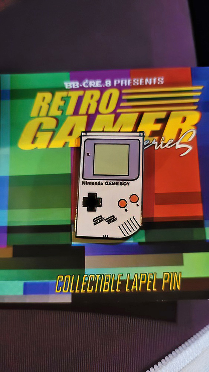 Before smartphones, this little brick was portable gaming&mdash;now immortalized as wearable nostalgia for those who remember blowing on cartridges.