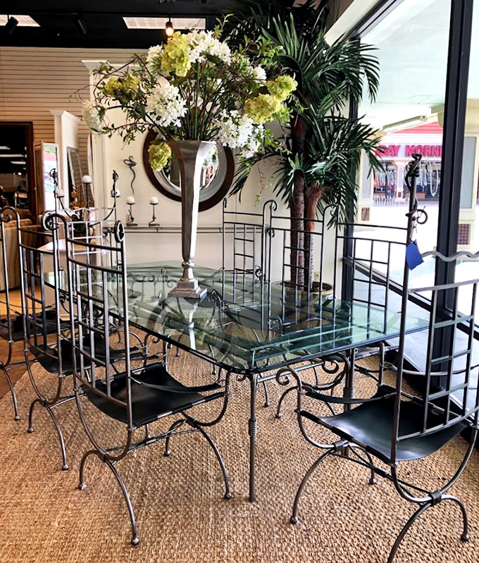 Wrought iron meets glass in this dining set that would make even takeout feel like a special occasion.