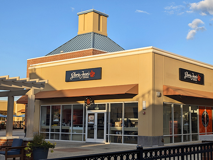 Gloria Jean's corner spot catches the golden hour light perfectly, promising caffeinated salvation to shoppers who've hit their second wind&mdash;or need to find it. 