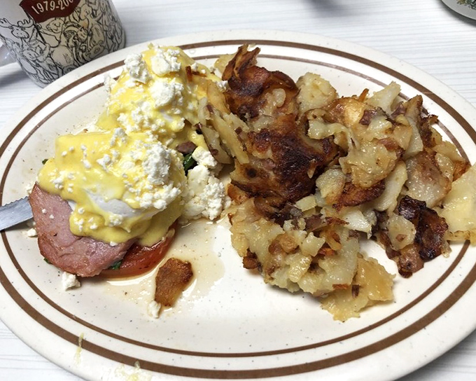 Breakfast innovation meets comfort food &ndash; a Benedict variation featuring ham and perfectly cooked potatoes that would make any brunch enthusiast swoon.