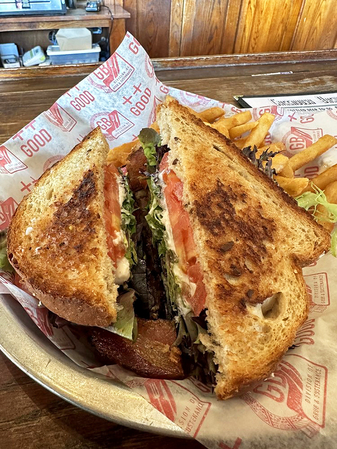 A sandwich cut diagonally because Greenbush knows the scientific fact that triangular sandwiches taste better. Those golden fries are basically potato-shaped happiness.