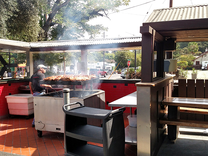 Where smoke meets meat in the California sunshine. The grill master tends to his craft with the focus of a surgeon and patience of a saint.