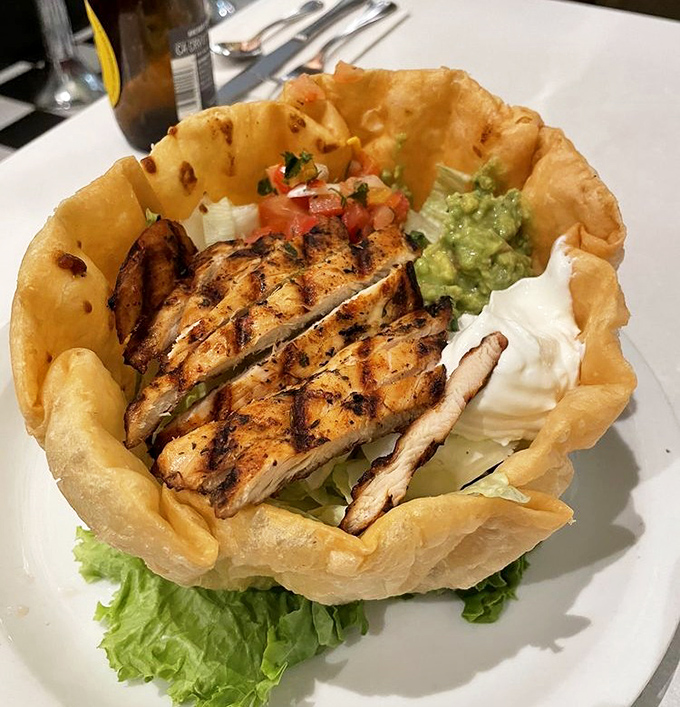 This tostada isn't just a meal&mdash;it's edible engineering. A crispy foundation supporting layers of flavor that defy gravity.