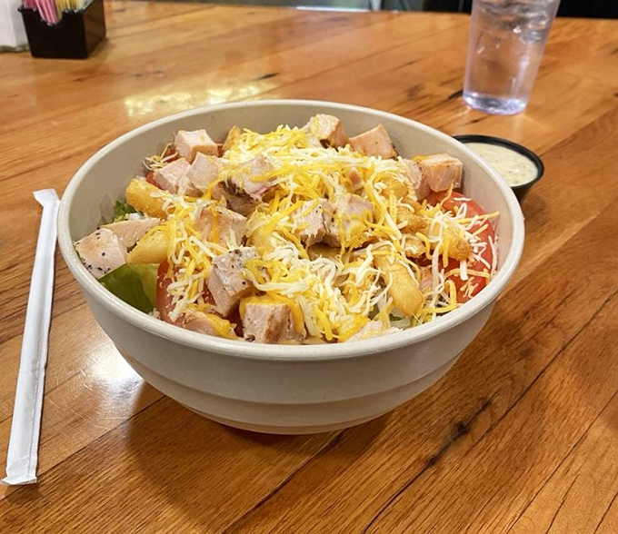 A salad that doesn't feel like punishment. Fresh ingredients, grilled chicken, and enough cheese to remind you that pleasure still matters.