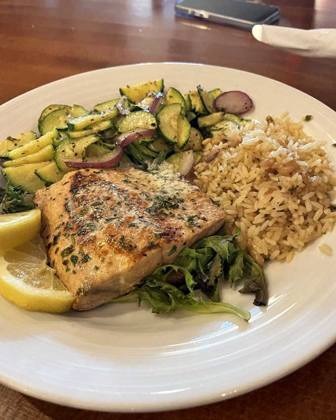 Salmon that's traveled upstream and upscale – perfectly seared and proving that even in beef country, seafood can steal the spotlight.