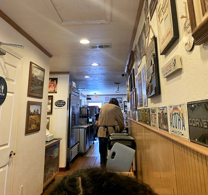 Walking down this hallway feels like stepping into a time capsule of American diner culture. Every inch tells a story of comfort and community.