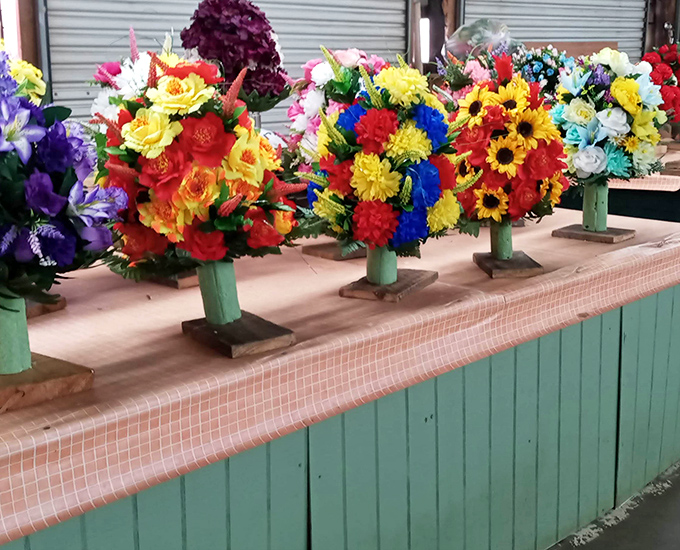 A rainbow explosion of silk flowers brings permanent spring to any home. These blossoms never wilt, even under the harshest criticism from your mother-in-law.