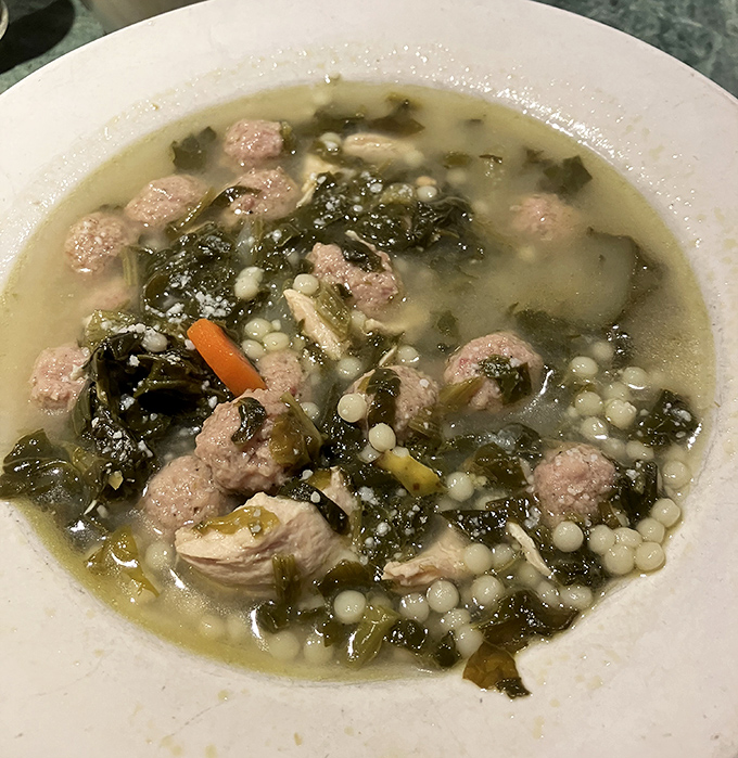 Wedding soup that grandmothers would approve of&mdash;tiny meatballs swimming with escarole in broth that tastes like someone's been stirring it since morning.