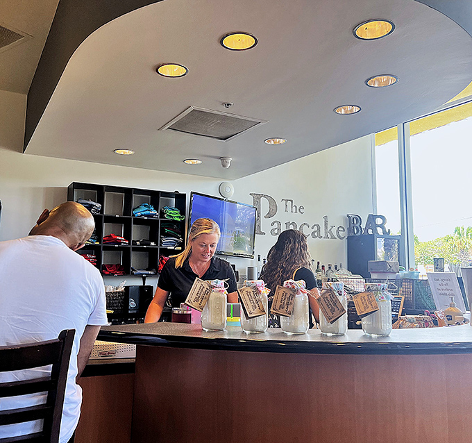 At the counter, friendly faces and coffee mugs await, ready to transform sleepy tourists into properly caffeinated breakfast enthusiasts.