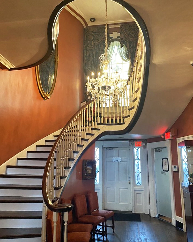 That staircase has witnessed generations of satisfied diners waddling down after memorable meals. Elegant, historic, and slightly intimidating.