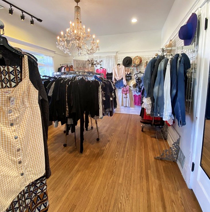 That chandelier hanging over racks of carefully curated clothing proves secondhand shopping can still deliver first-class ambiance.