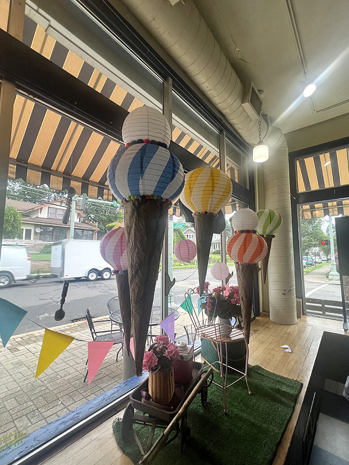 Paper lantern ice cream cones hanging in the window&mdash;a whimsical reminder that you've entered a place where fun is always on the menu.