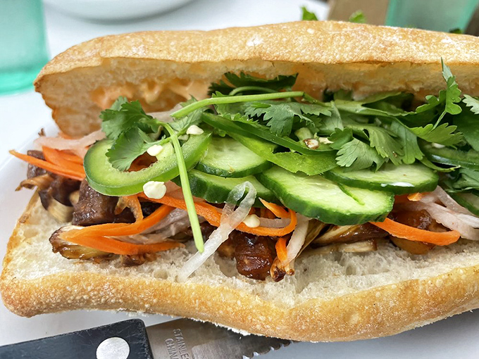 This banh mi sandwich is a textural masterpiece. Crisp vegetables, tender filling, and fresh herbs create a handheld vacation for your taste buds.