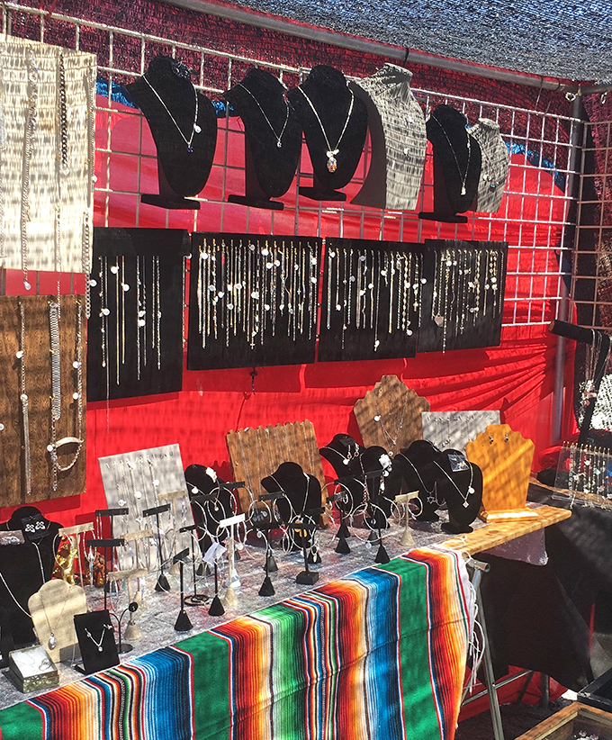 Jewelry displays that sparkle with possibility. Silver chains cascade like metallic waterfalls while pendants wait to become someone's new favorite accessory.