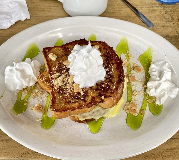 Key lime French toast that captures Florida sunshine on a plate &ndash; complete with artistic lime drizzles and whipped cream islands.