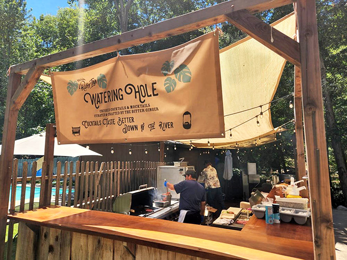 "The Watering Hole" lives up to its name with riverside refreshments. "Cocktails taste better down by the river" isn't just a slogan—it's science.