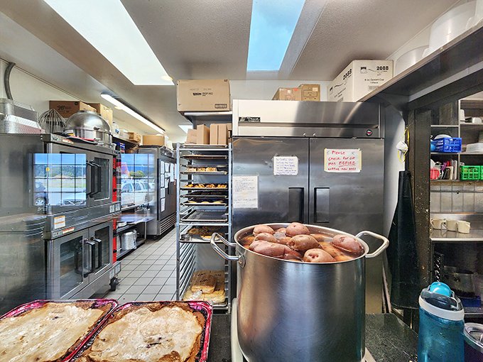 Behind the scenes where pie dreams become reality. That pot of potatoes isn't just food prep&mdash;it's potential happiness in starch form.