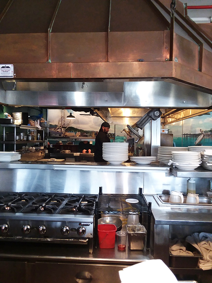 Where the culinary alchemy happens&mdash;gleaming stainless steel, copper hoods, and chefs who know exactly how long that artichoke needs on the oak grill.