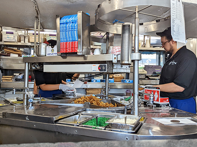 The kitchen reveals the organized chaos where Chicago's iconic hot dogs come to life&mdash;a symphony of condiments conducted with practiced precision. 