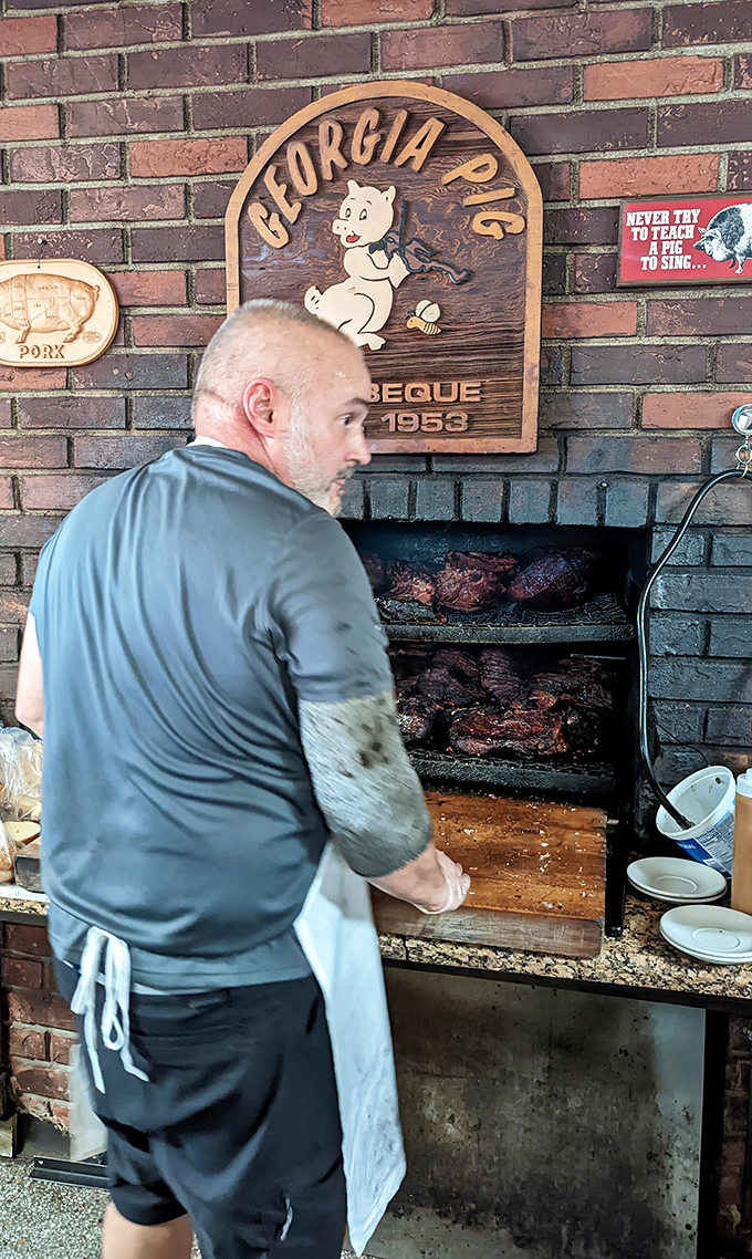 The open pit reveals the secret&mdash;real wood, real smoke, real patience. No shortcuts in sight, just craftsmanship you can taste.