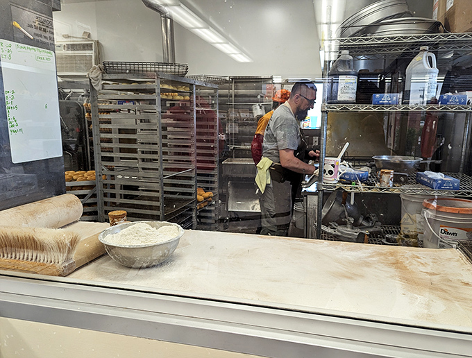 Behind-the-scenes magic where flour transforms into dreams. The kitchen view—a rare glimpse into the laboratory where happiness is engineered.