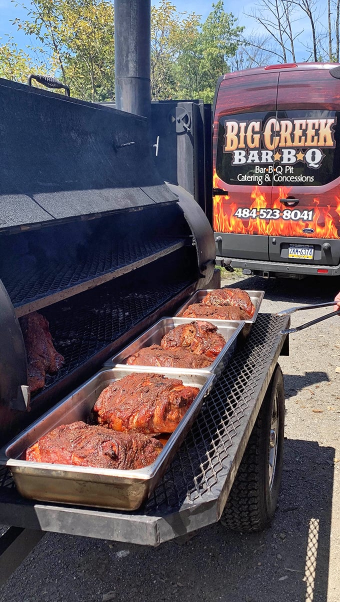 Meat trays lined up like soldiers awaiting deployment. These pork shoulders have been smoking longer than some people stay at their jobs.
