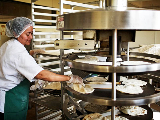 Fresh tortillas being lovingly prepared&mdash;the unsung heroes of every great Tex-Mex meal. Each one a perfect, pillowy canvas for culinary masterpieces.