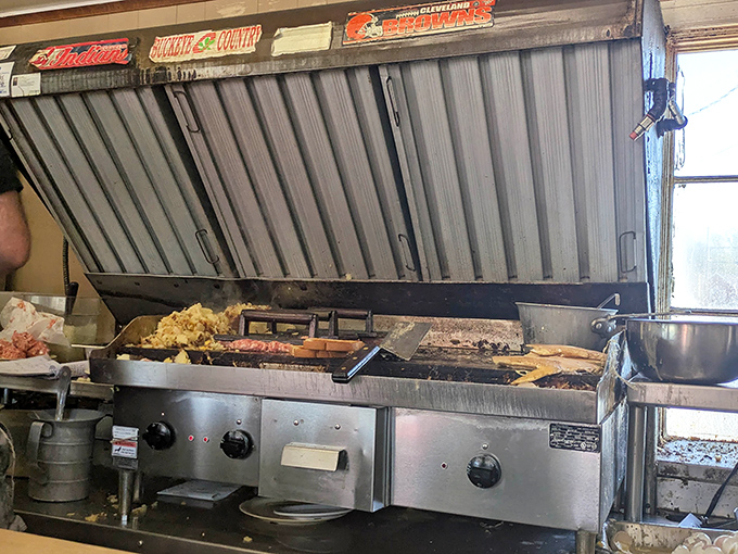 Where Ohio sports loyalties hang above the grill, seasoning every dish with a dash of local pride.