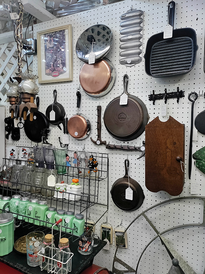 Cast iron that's seen decades of family dinners hangs alongside copper that gleams with stories. Kitchen history displayed like culinary art.