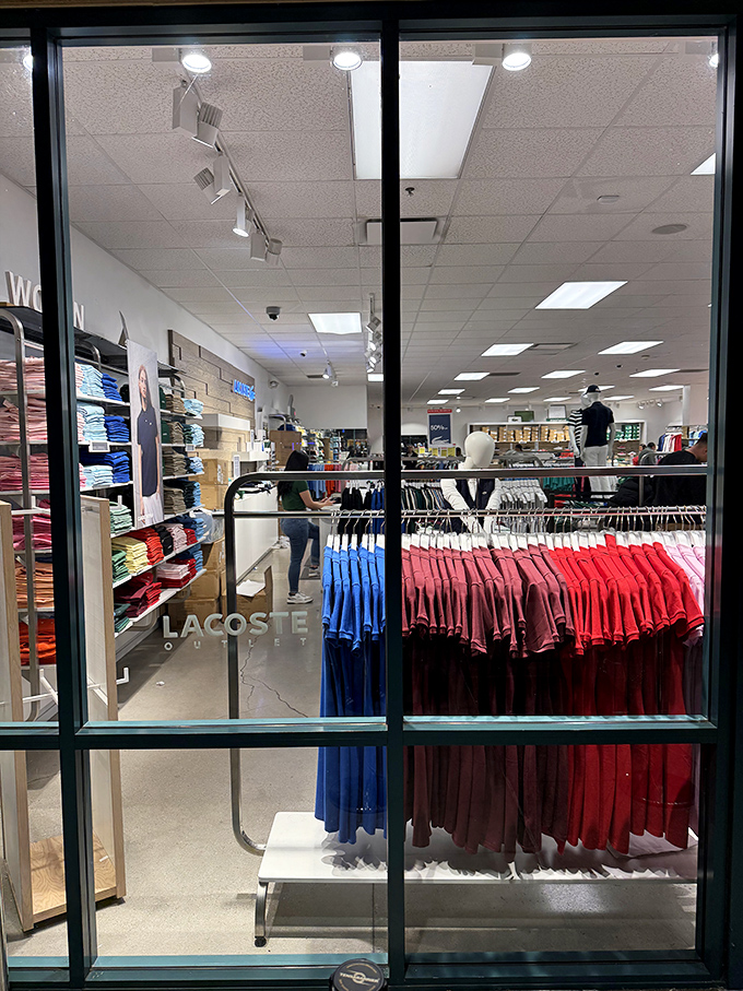 Inside Lacoste, a rainbow of polos stands at attention like a well-dressed army ready to elevate your casual Friday game.