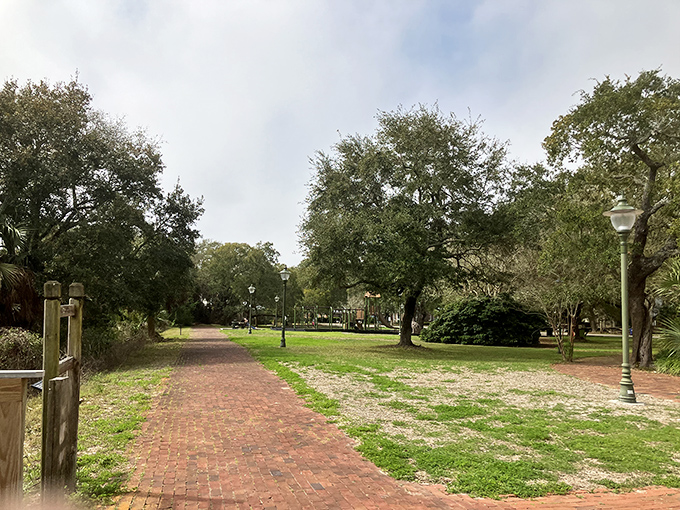 Lafayette Park's brick pathways meander beneath ancient oaks draped in Spanish moss &ndash; Mother Nature's version of mood lighting for an afternoon stroll.