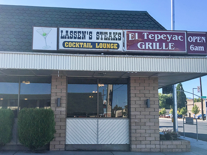 Lassen's Steaks and El Tepeyac Grille share billing on this sign, a culinary United Nations where ribeyes and enchiladas live in perfect harmony.