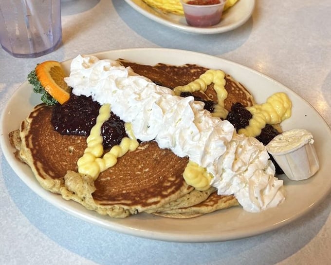 These pancakes, crowned with whipped cream and berries, blur the line between breakfast and dessert in the most delightful way.