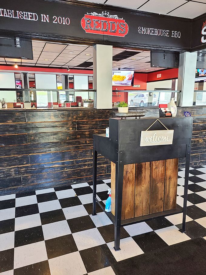 Rustic wood paneling and checkerboard floors welcome you to a place where smoke and time transform meat into magic.