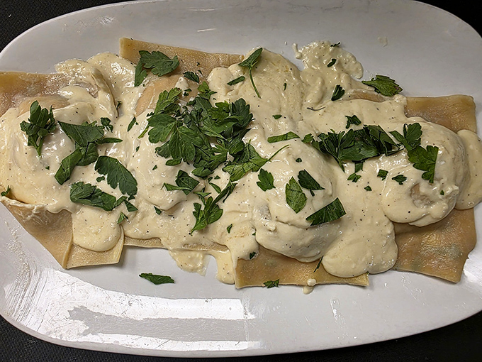 Lobster ravioli draped in cream sauce and fresh herbs &ndash; pasta pillows stuffed with ocean treasure. Fork-twirling has never been so rewarding.