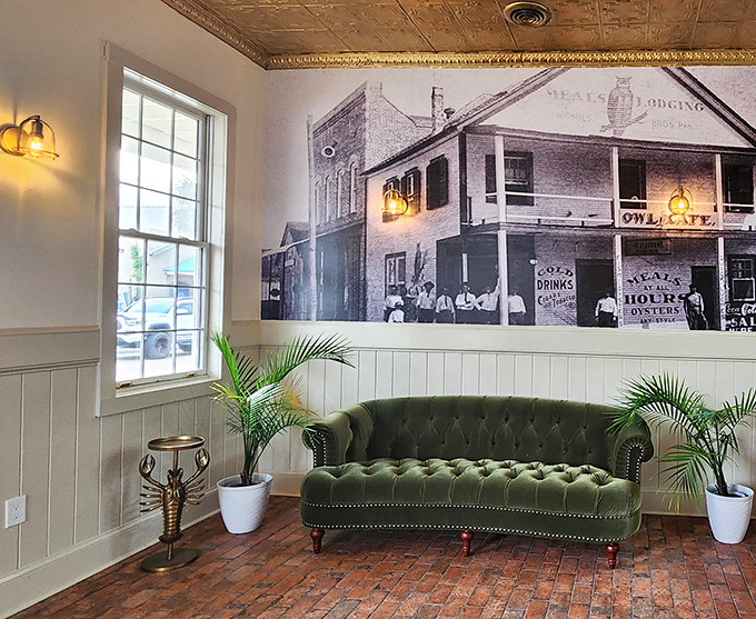 A vintage photograph watches over a green velvet sofa, reminding visitors of The Owl's long history in Apalachicola. Some things just get better with age.