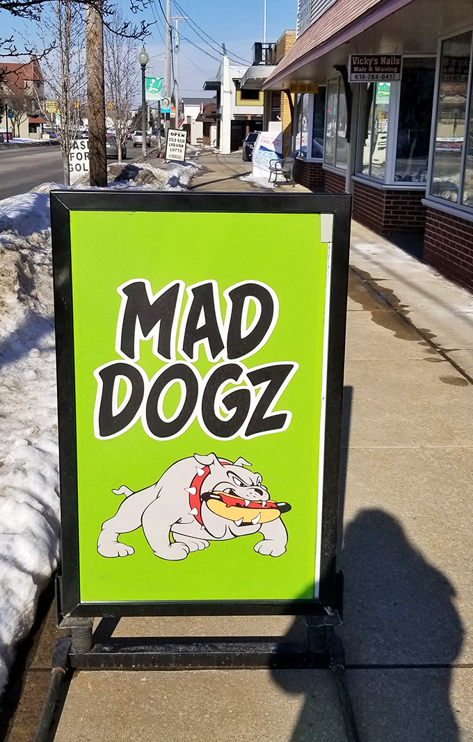 The sidewalk sign promises adventures in hot dog excellence that deliver beyond all expectations.