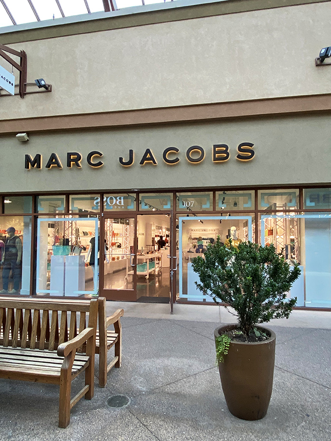 Marc Jacobs brings high fashion to outlet prices with its sleek, minimalist storefront. Luxury becomes slightly more attainable behind these gleaming glass doors.