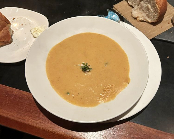 This crab bisque doesn't whisper its seafood flavor &ndash; it announces it proudly with a velvety texture that coats your spoon just right.